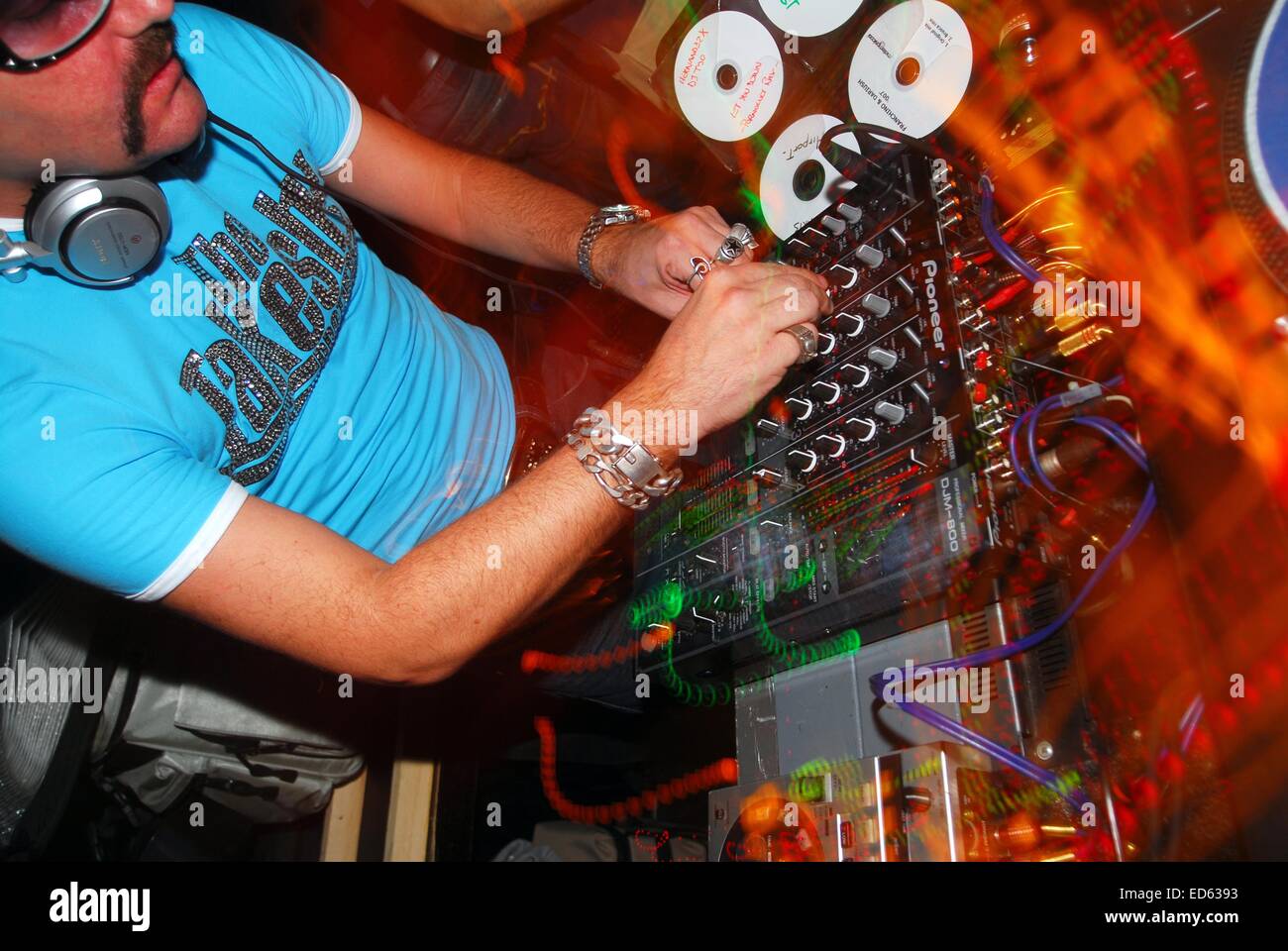 Disk jockey play music in DJ console at party Stock Photo - Alamy