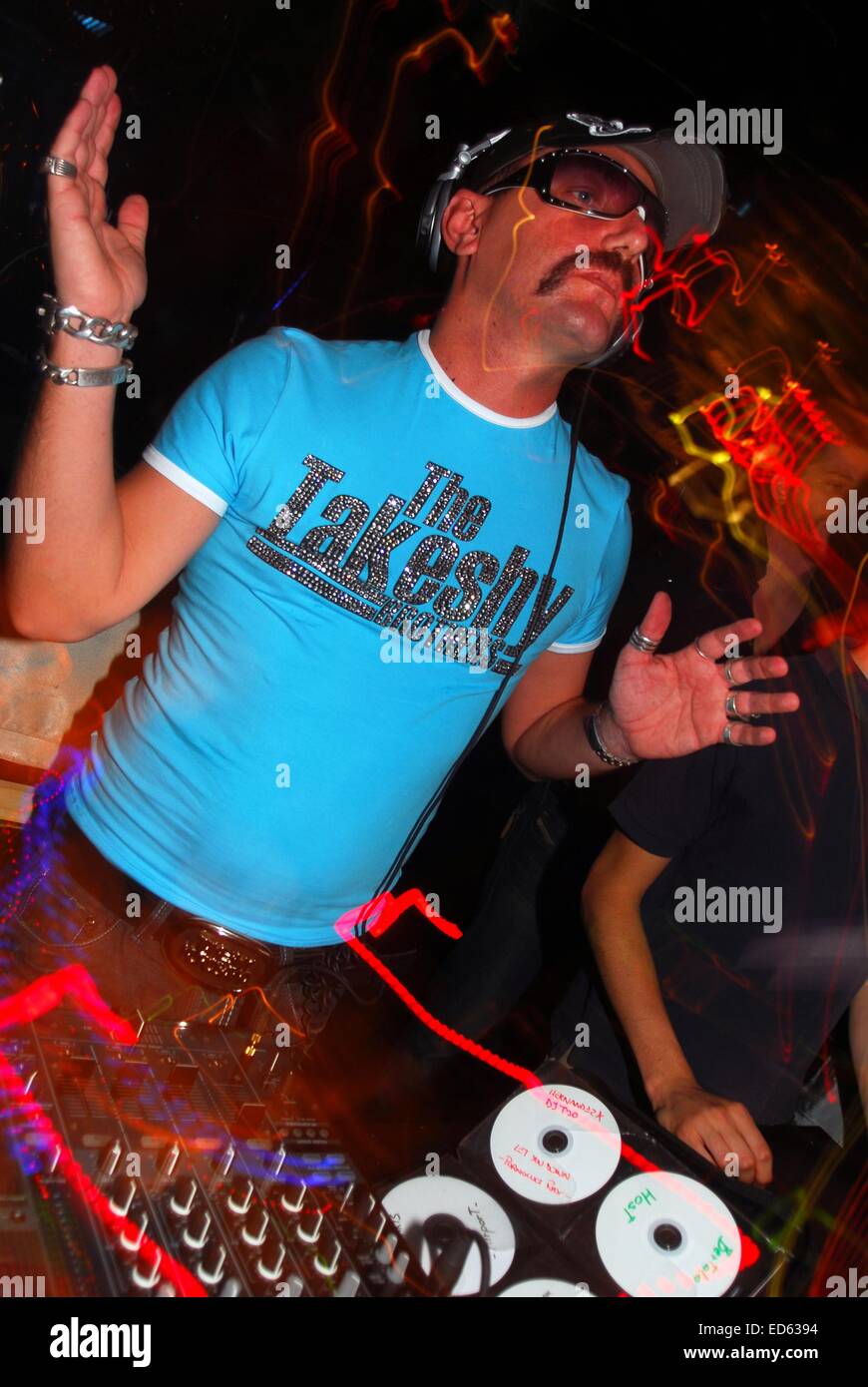 Disk jockey play music in DJ console at party Stock Photo - Alamy