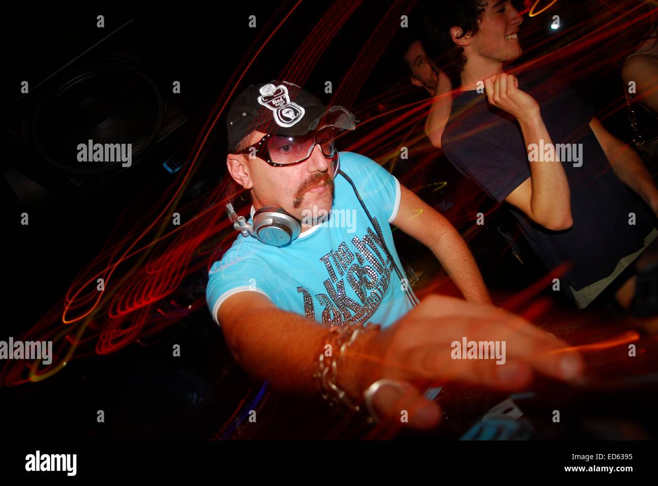 Disk jockey play music in DJ console at party Stock Photo - Alamy