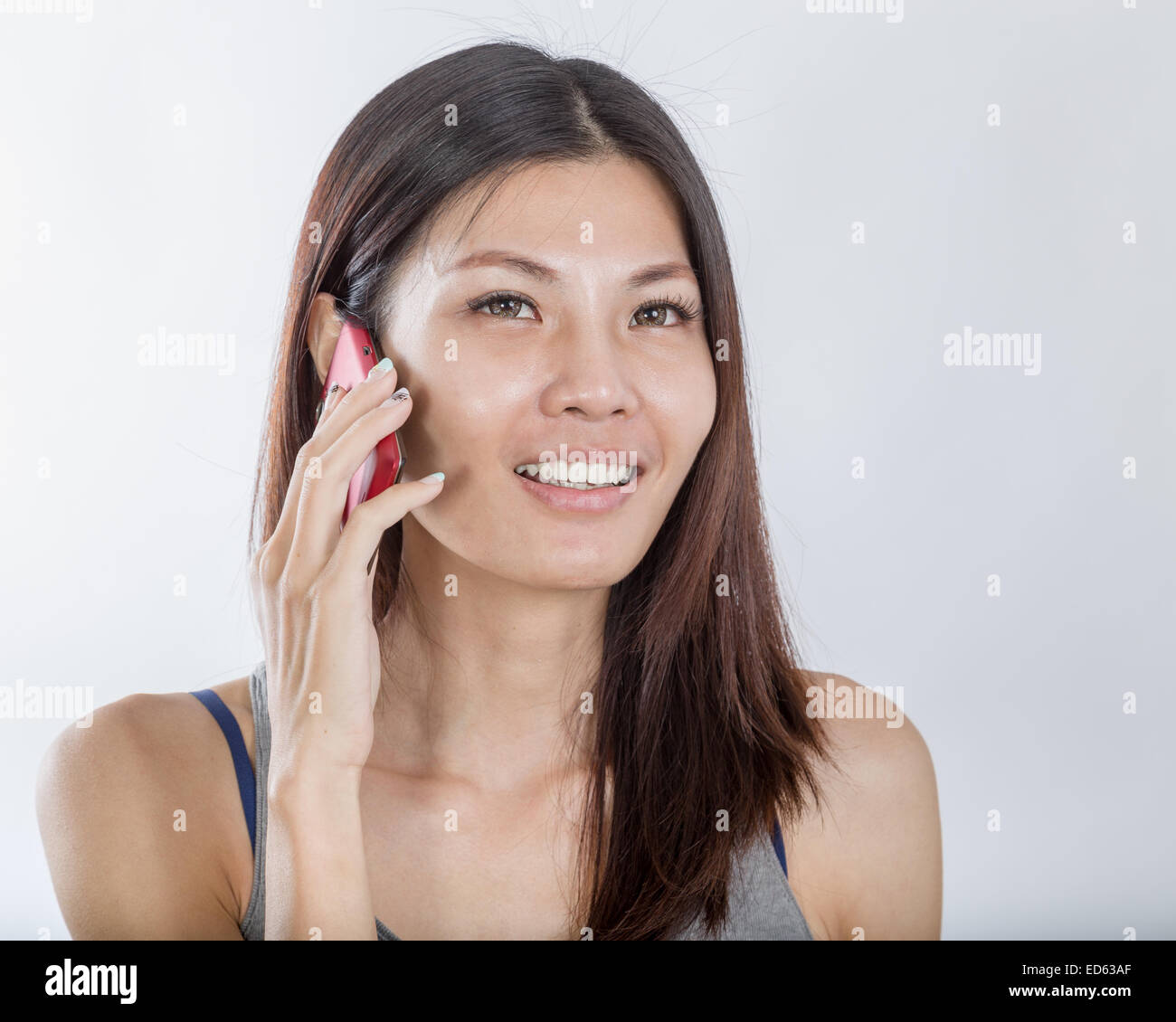 Beautiful Chinese woman talking on smartphone happily Stock Photo - Alamy Beautiful Chinese woman talking on smartphone happily Stock Photo - Alamy