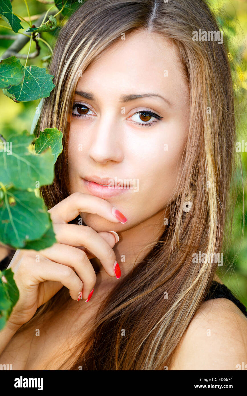 Portrait of smiling and charming lady woman girl outdoor with forrest ...