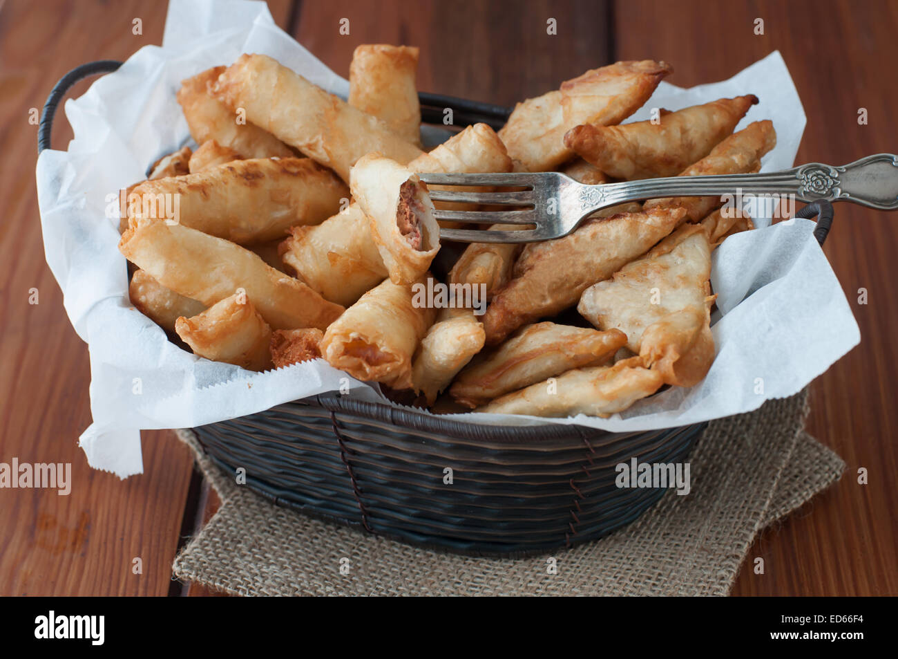 cheese filled rolls and meat stuffed triangle wraps Stock Photo - Alamy