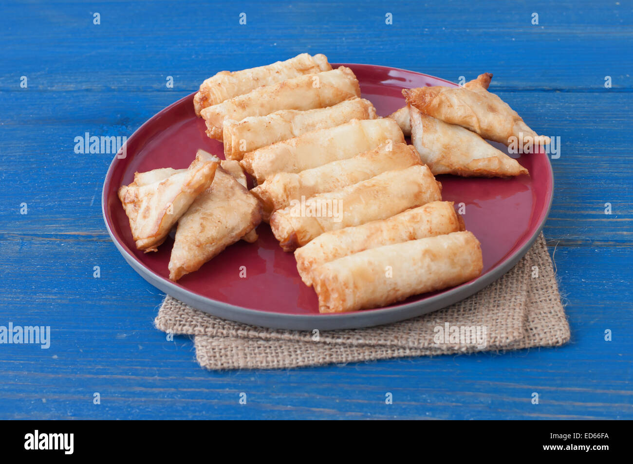 cheese filled rolls and meat stuffed triangle wraps Stock Photo - Alamy
