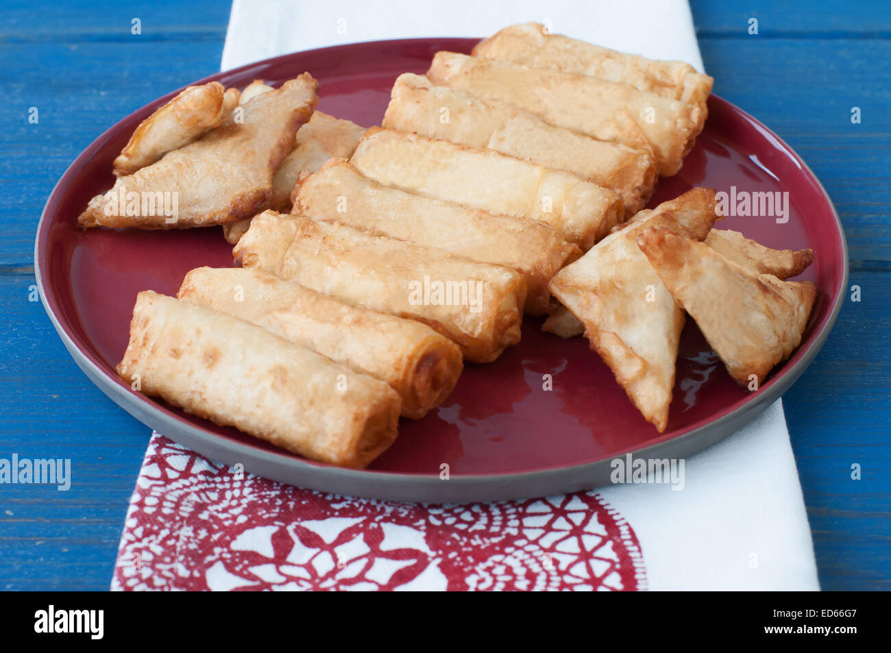 cheese filled rolls and meat stuffed triangle wraps Stock Photo - Alamy