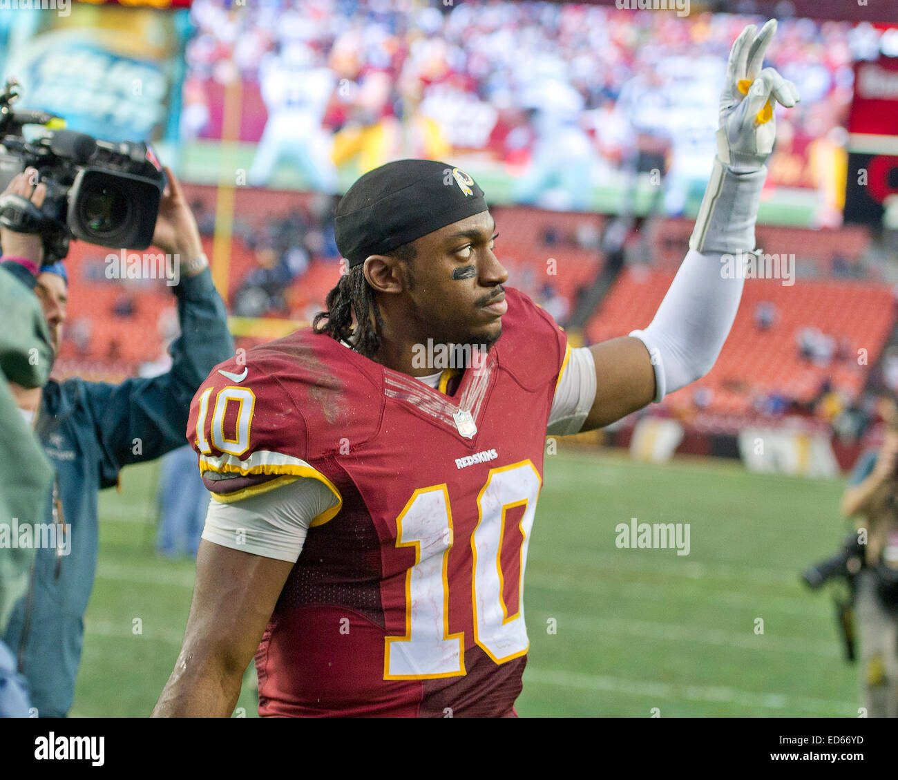 Washington Redskins quarterback Robert Griffin III (10) acknowledges ...