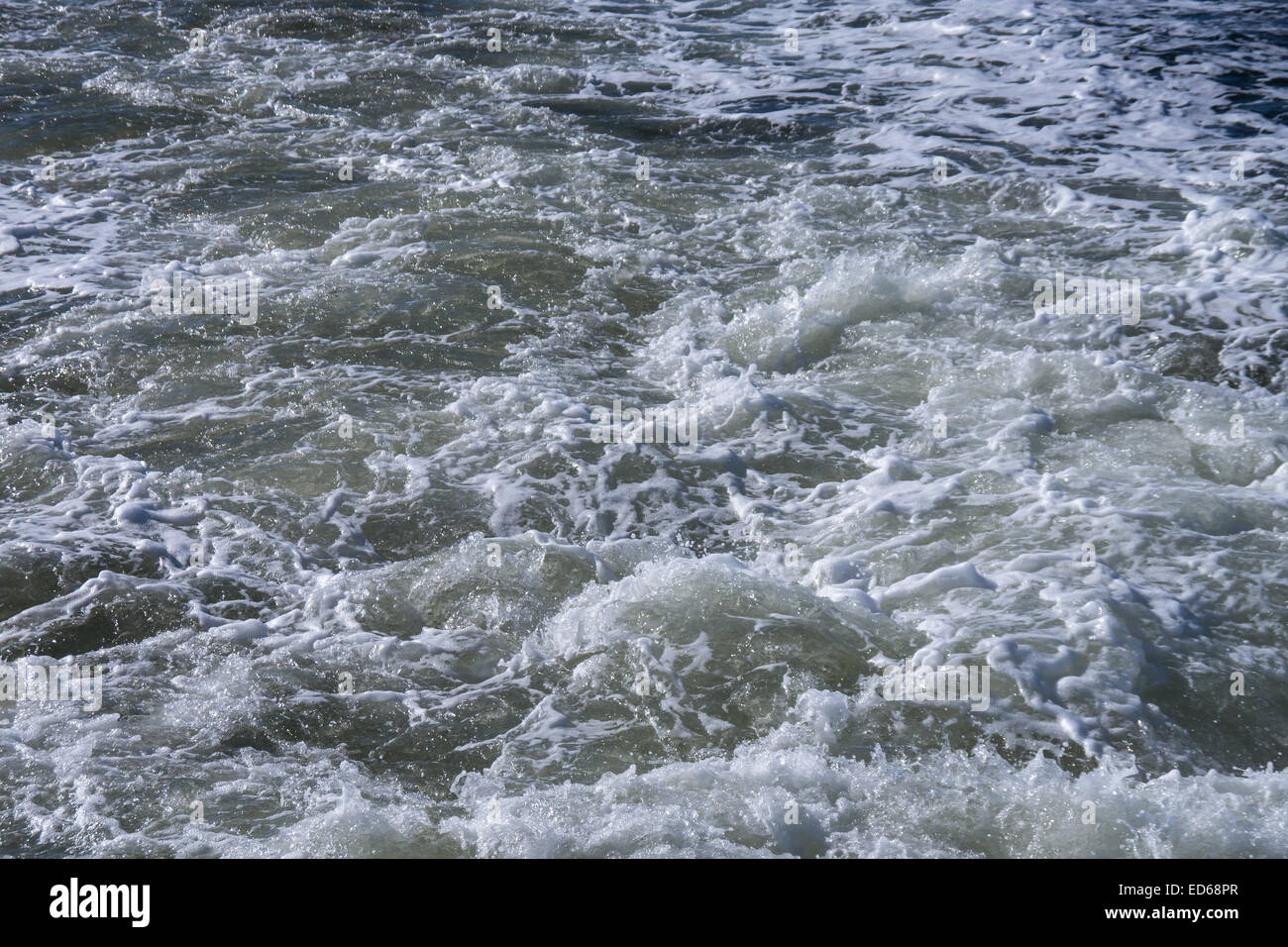 spindrift behind a ship on north sea Stock Photo - Alamy