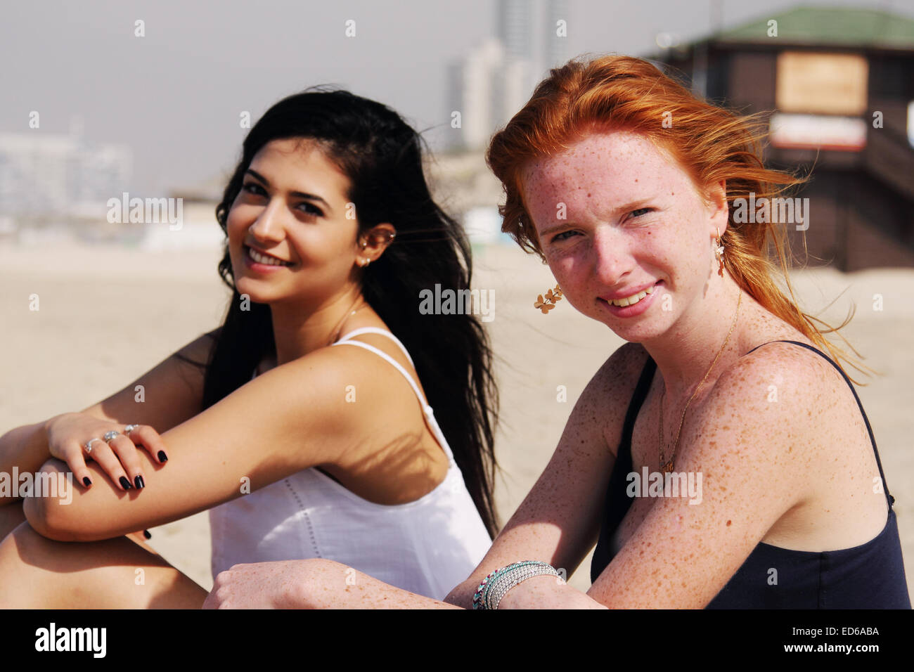 Two people walking beach sun hi-res stock photography and images - Alamy