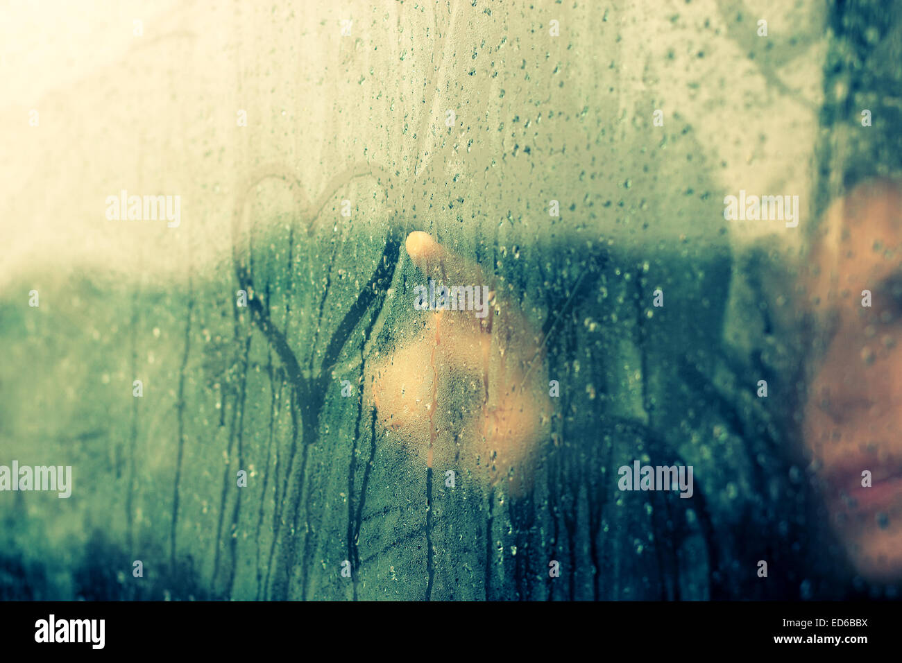 Woman rain on window hi-res stock photography and images - Alamy