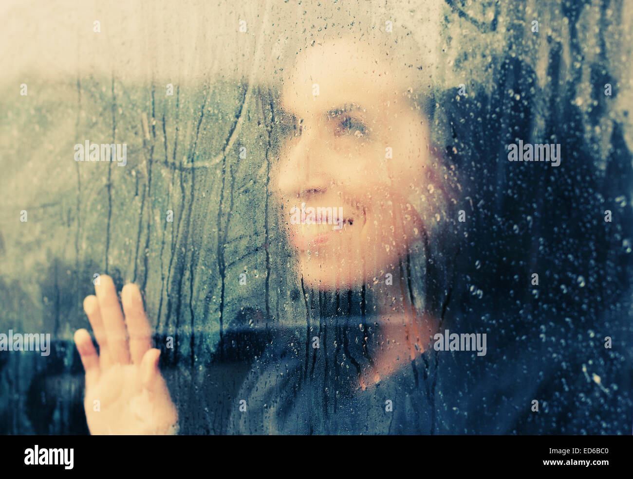 beautiful woman stands in front of the window Stock Photo - Alamy