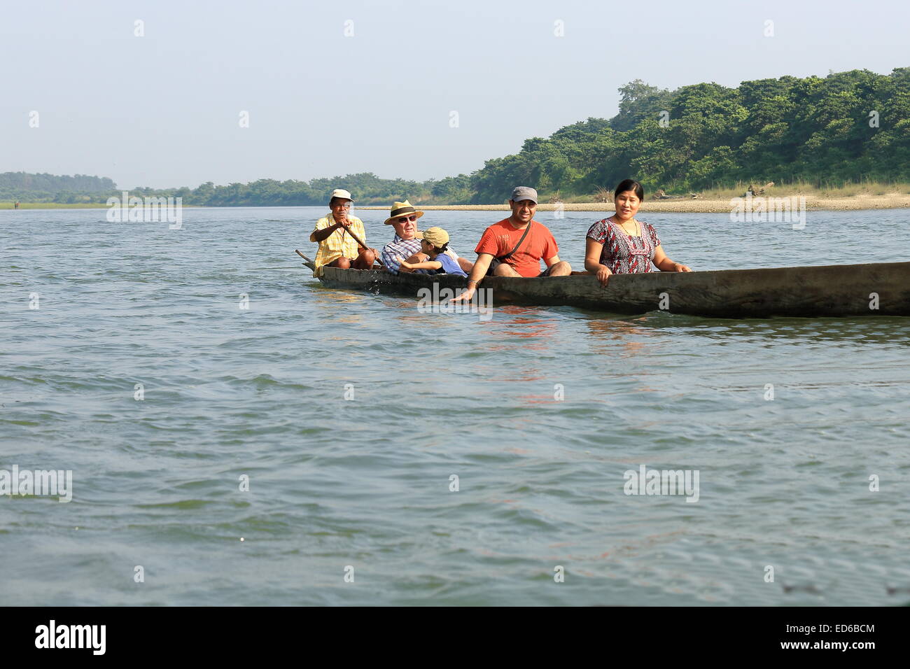CHITWAN, NEPAL - OCTOBER 14: Tourists on wooden rowboats visit the ...