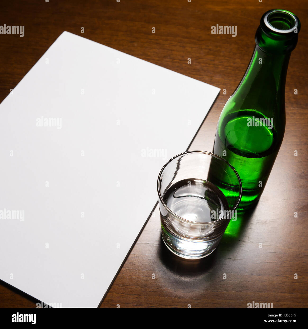 note and glass of water on desk Stock Photo - Alamy