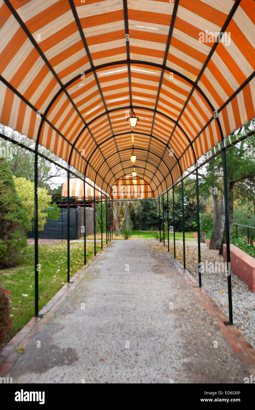 Covered pathway with lanterns at gardens. Autumn season Stock Photo - Alamy