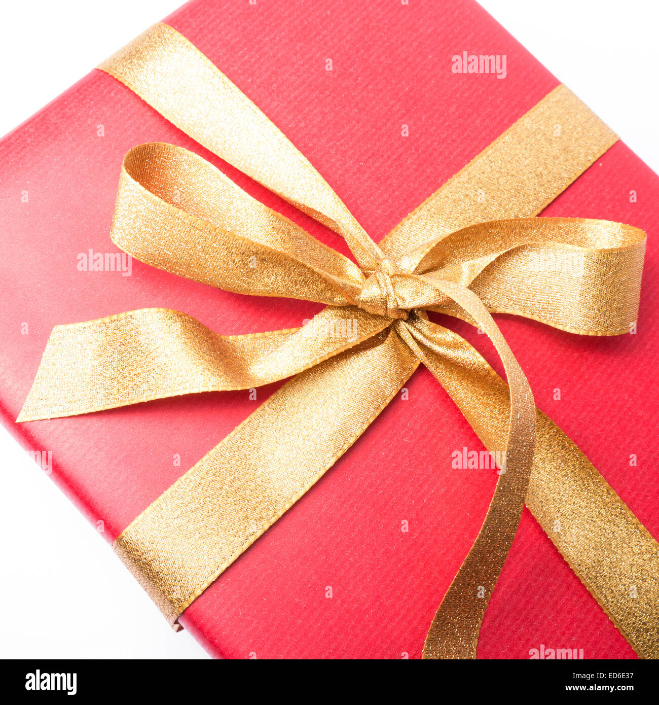 red present with golden loop on white background Stock Photo - Alamy