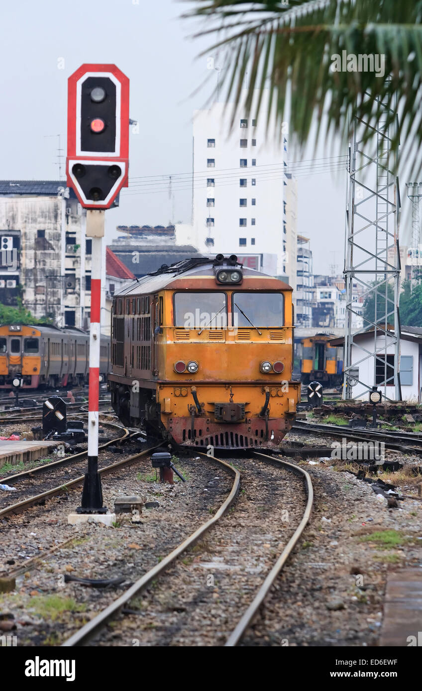 Orange Train locomotive approaching to Bangkok Railway Station Thailand ...