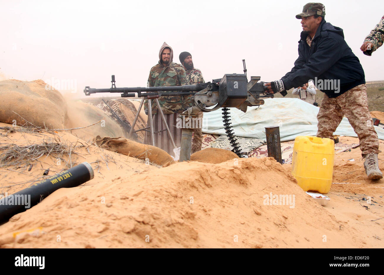 Tripoli, Libya. 29th Dec, 2014. A Libya Dawn fighter aims his weapon ...