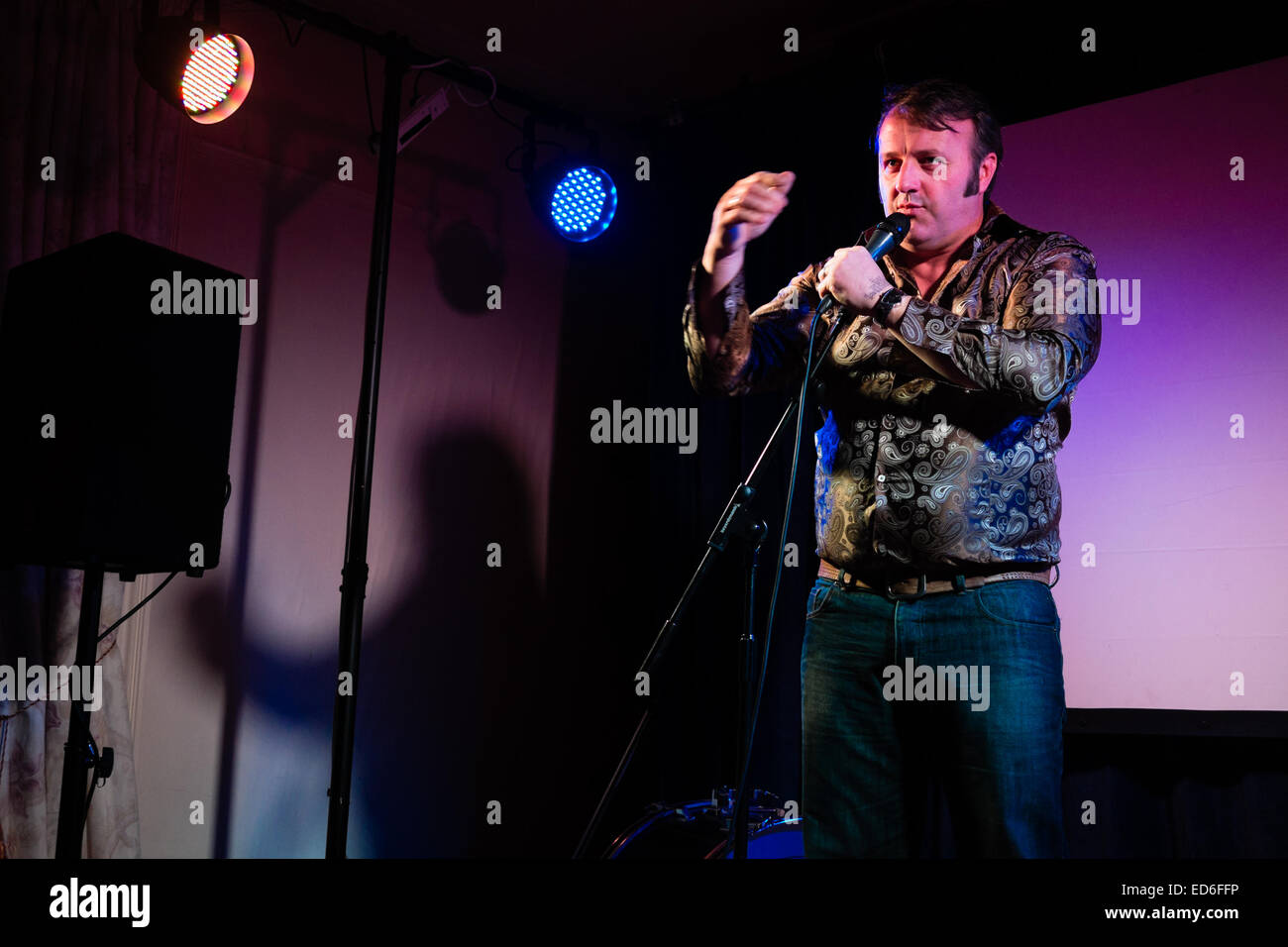 Welsh stand up comedian MIKE BUBBINS performing in a small club, Wales ...