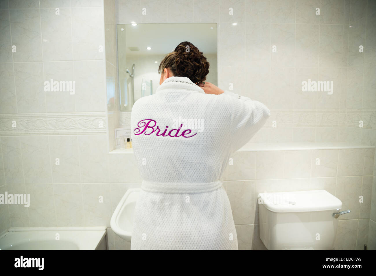 Getting married : rear view of a woman wearing a 'bride' dressing gown ...