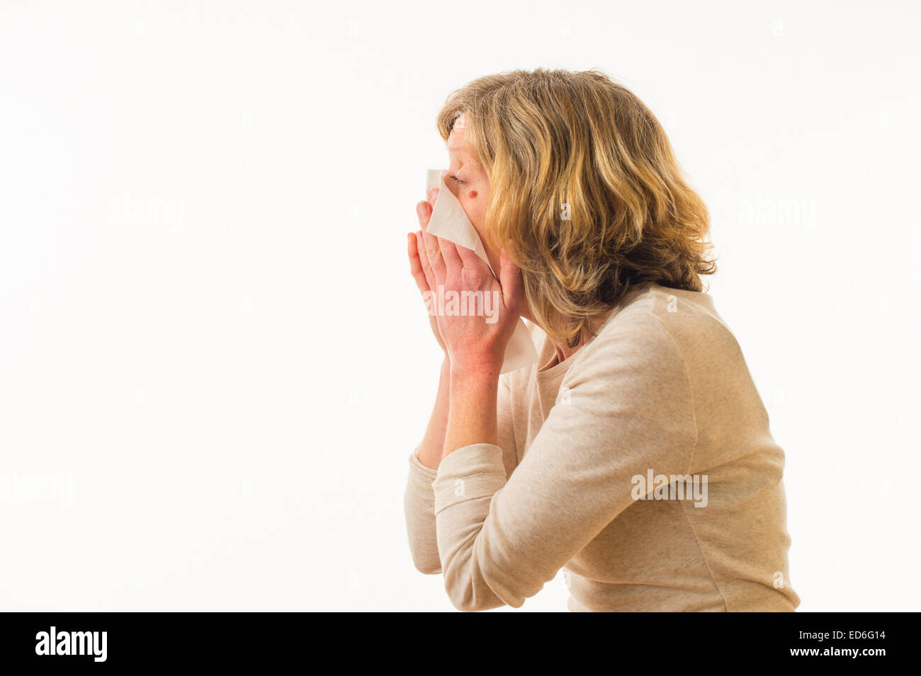 A forty year old caucasian adult woman suffering with a cold or flu ...