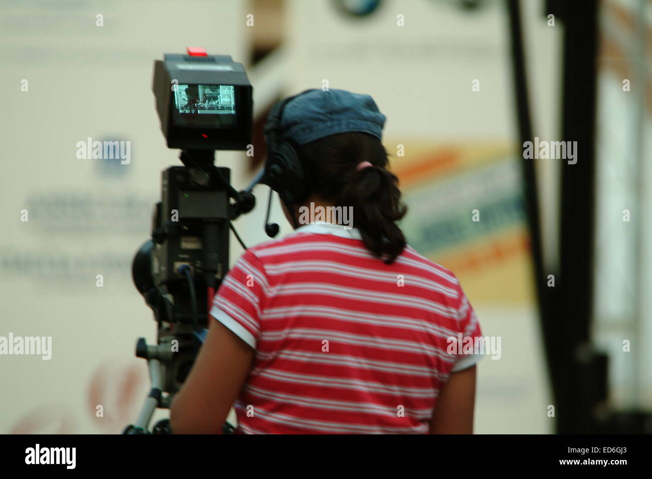 TV cameraman operating a broadcast camera Stock Photo - Alamy