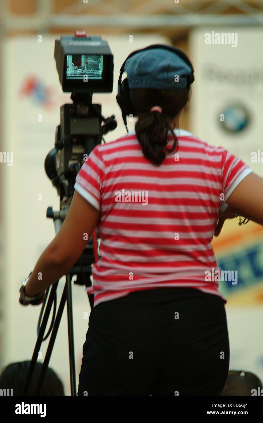 TV cameraman operating a broadcast camera Stock Photo - Alamy