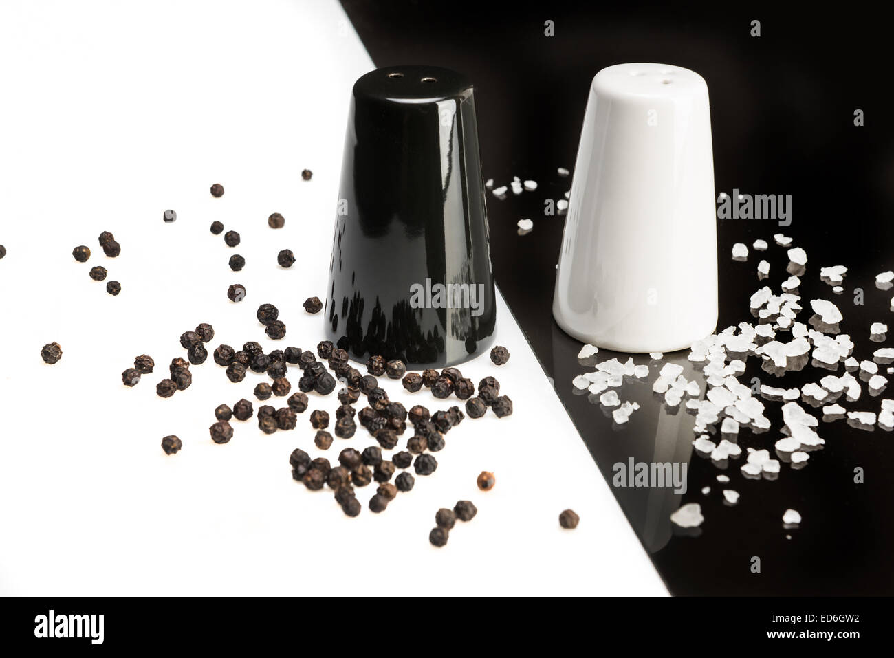 black pepper shaker on white background and peppercorns, white ...