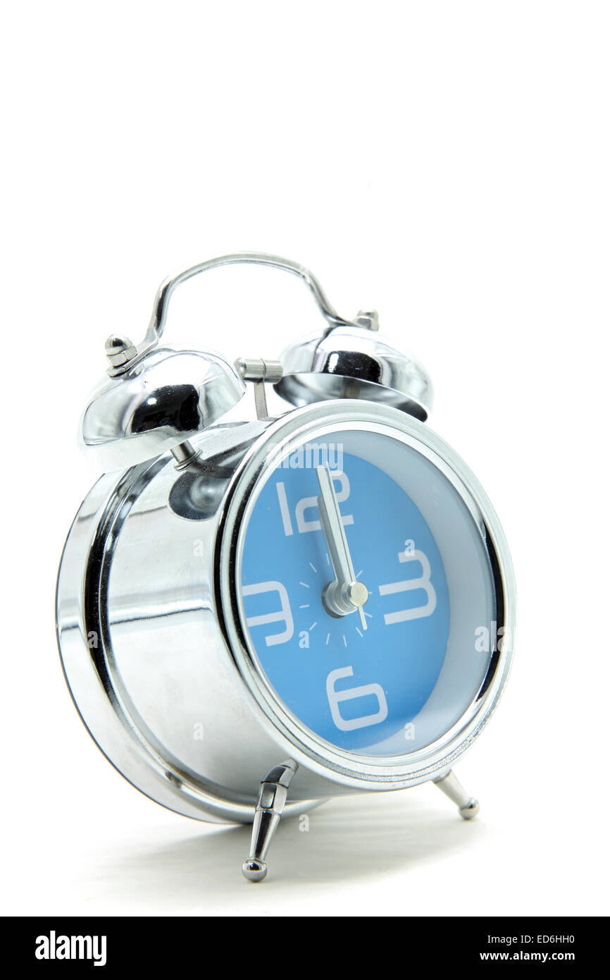 isolated blue alarm clock on white side perspective Stock Photo - Alamy