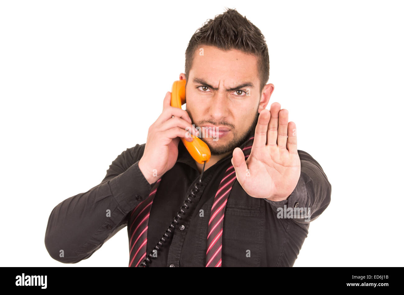 closeup portrait of handsome hispanic man talking on corded retro phone ...