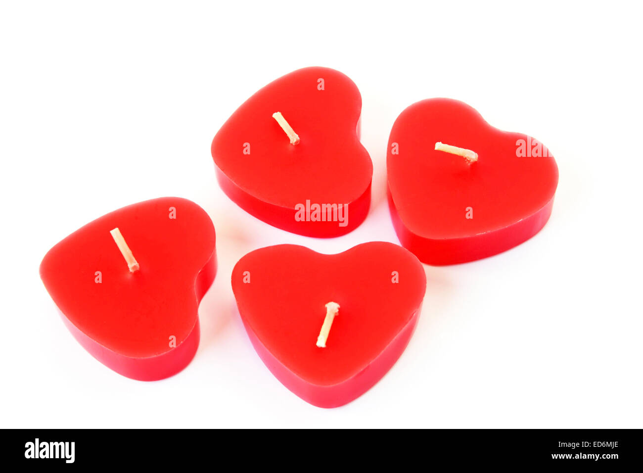 Heart shape red candles isolated on white background Stock Photo - Alamy