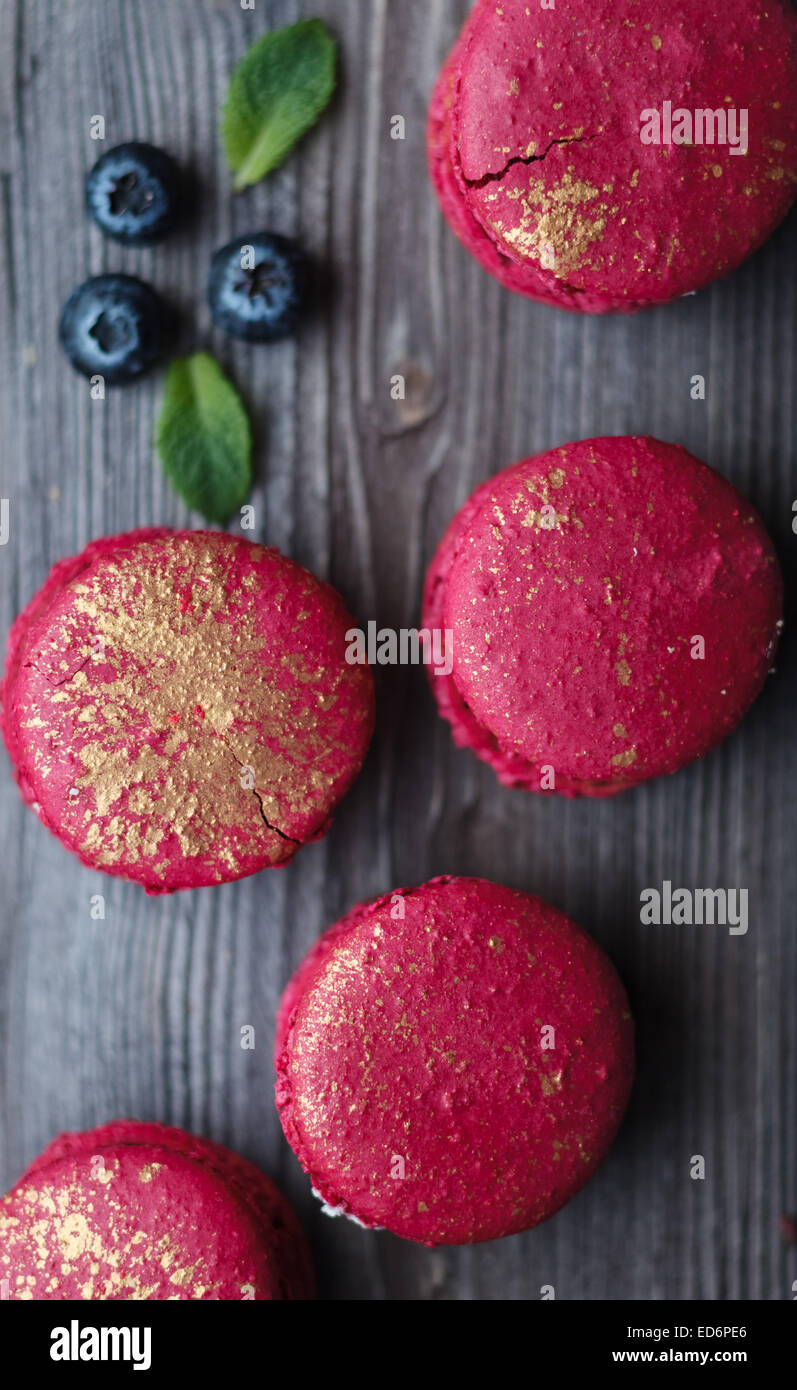 fresh macaroons and ripe blackberry on a wooden background Stock Photo ...