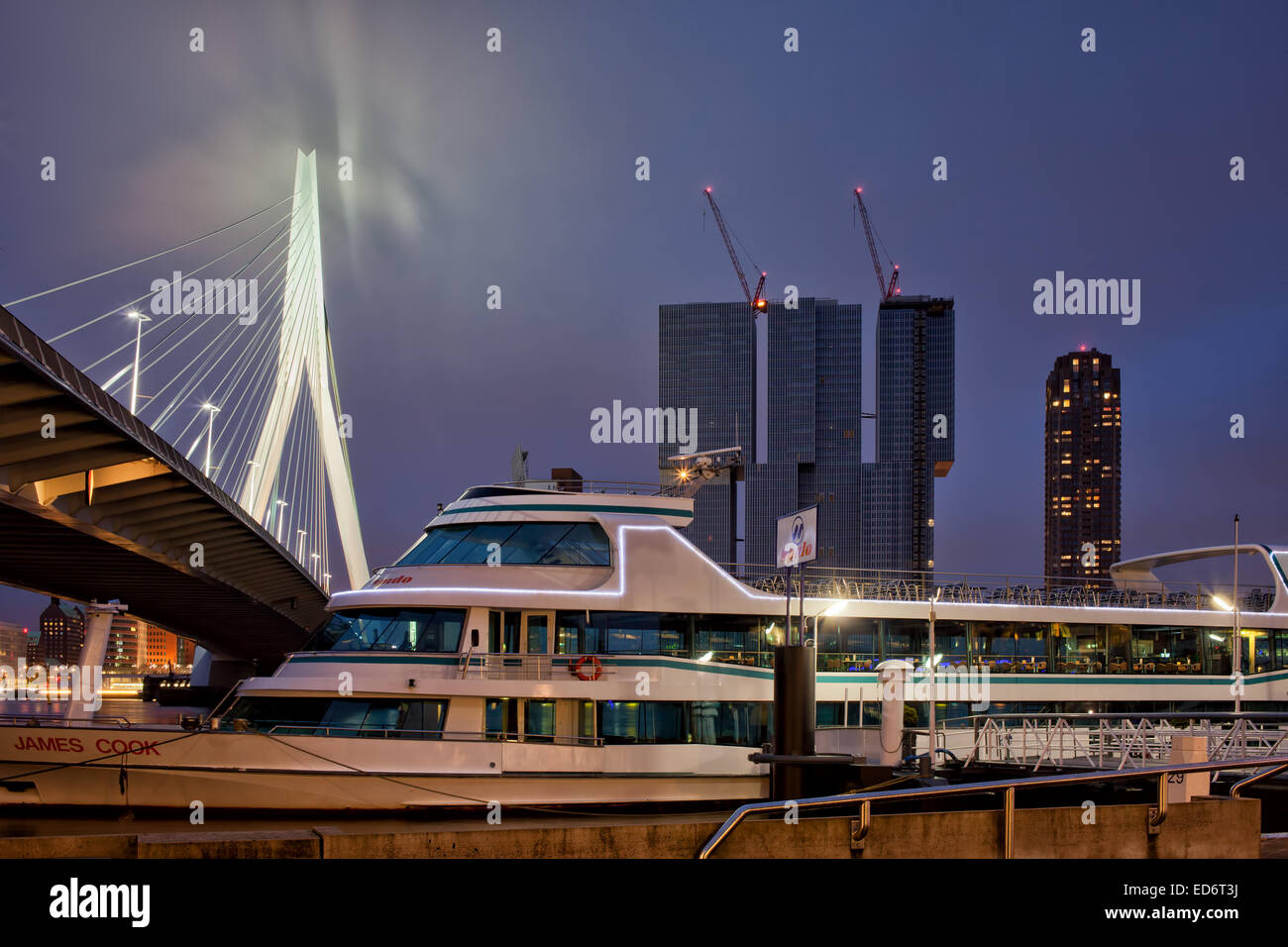 Rotterdam city downtown skyline at night, Spido tour ship at Erasmus ...