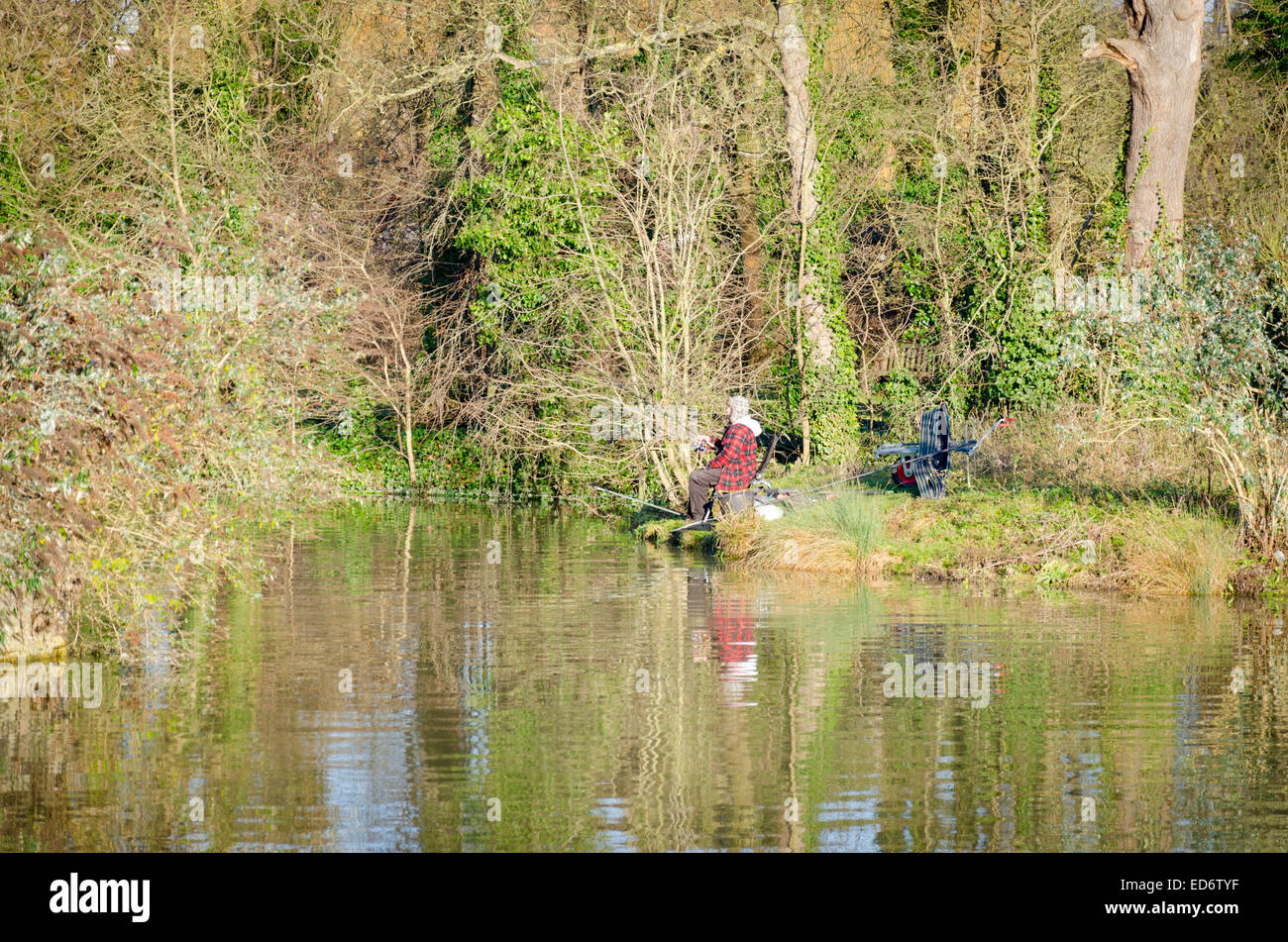 Cambridge, UK. 29 December 2014: Man fishing at the Mill Pond in ...