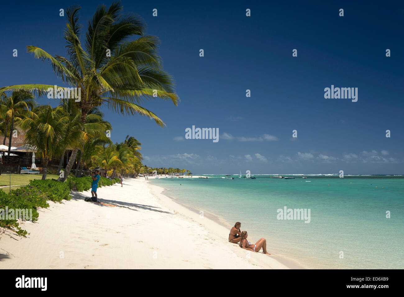 Mauritius, Le Morne, Lux Le Morne hotel beach, two women sunbathing on ...