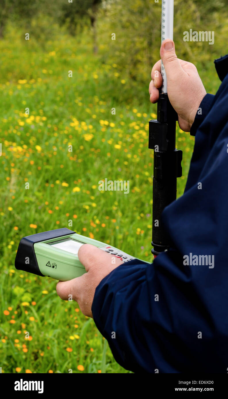 Surveyor with GPS kit at a country roadside Stock Photo - Alamy