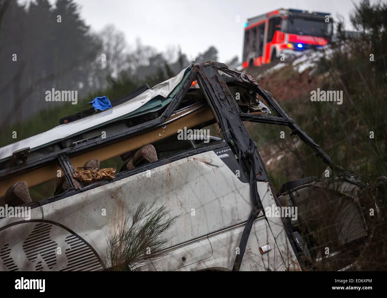 Bad Hersfeld, Germany. 30th Dec, 2014. A fully destroyed coach lies on ...