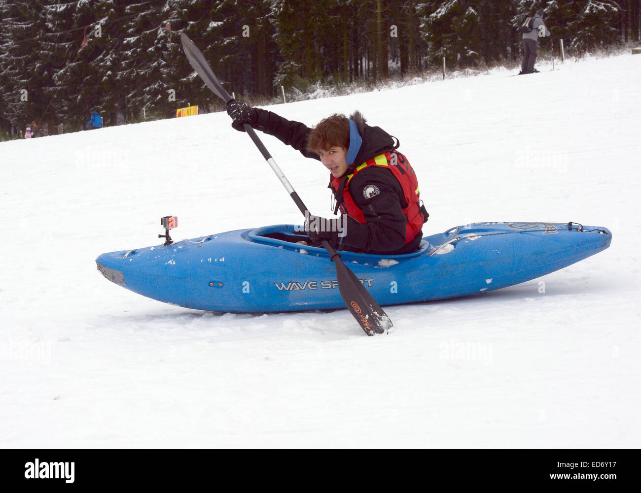 A teenager rides a canoe down the 'Weisser Stein' hill in the Eifel ...