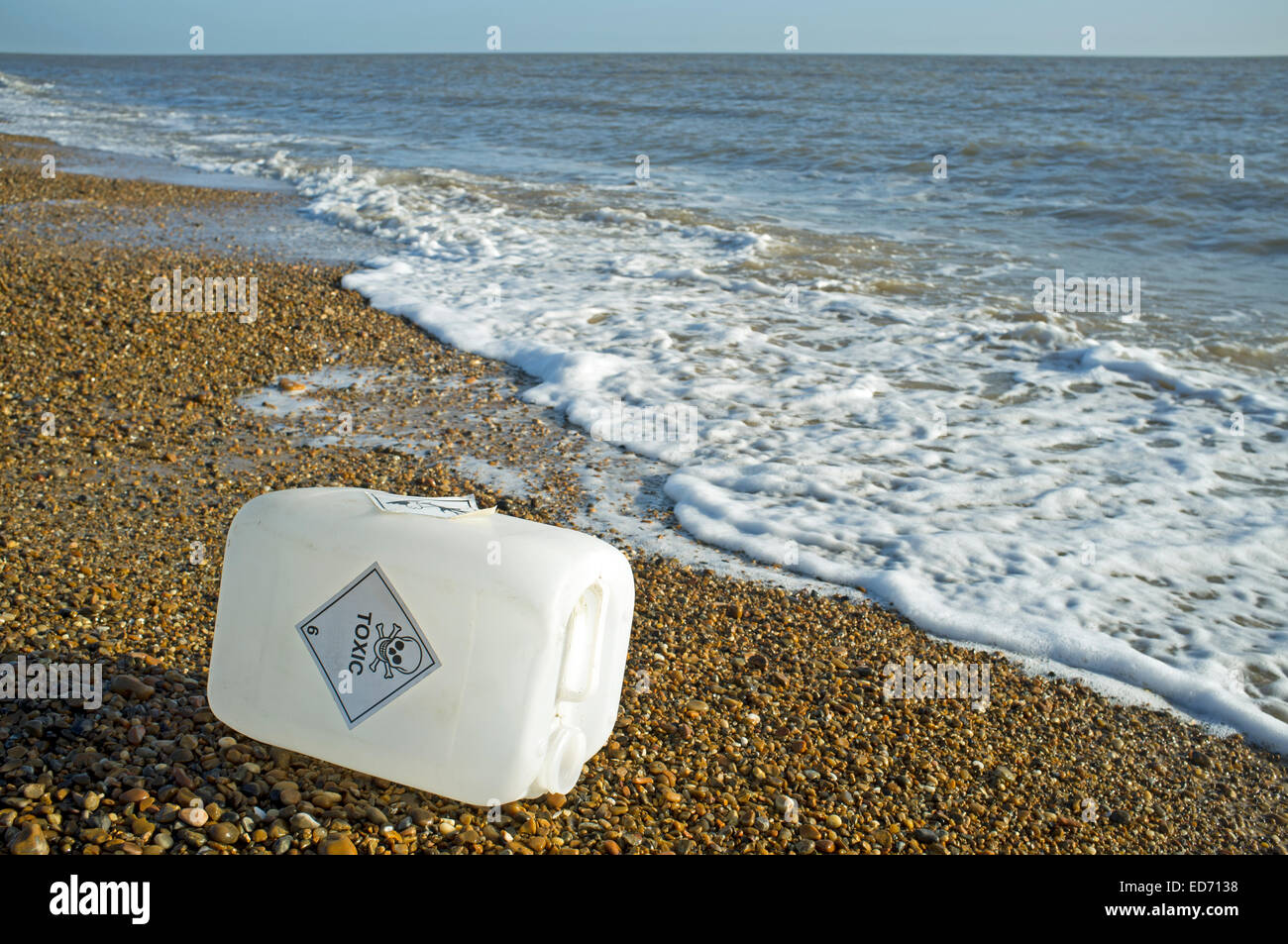 Plastic container with Toxic sticker, washed up on the North Sea beach ...