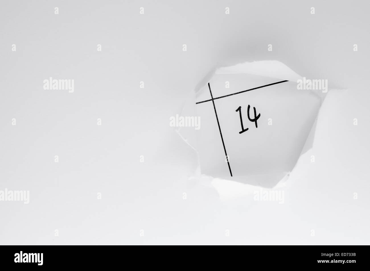numbers seen through white ripped paper Stock Photo - Alamy