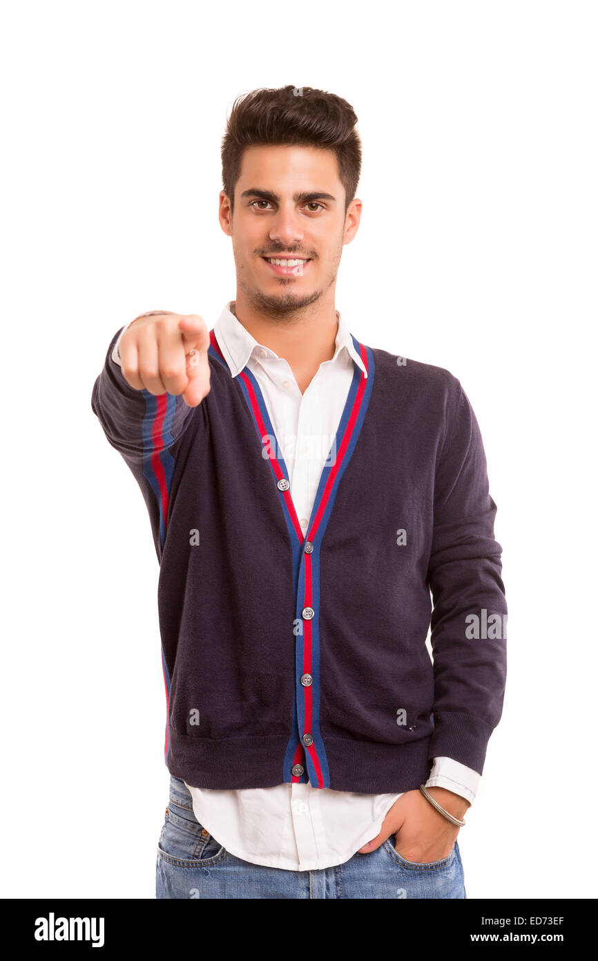 Handsome young man pointing at you, isolated over white background ...