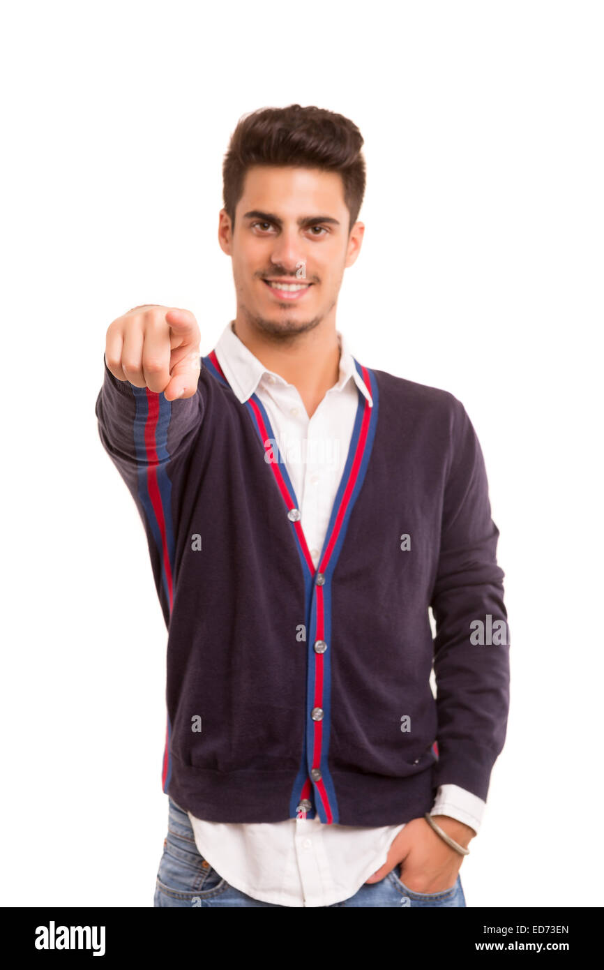 Handsome young man pointing at you, isolated over white background ...