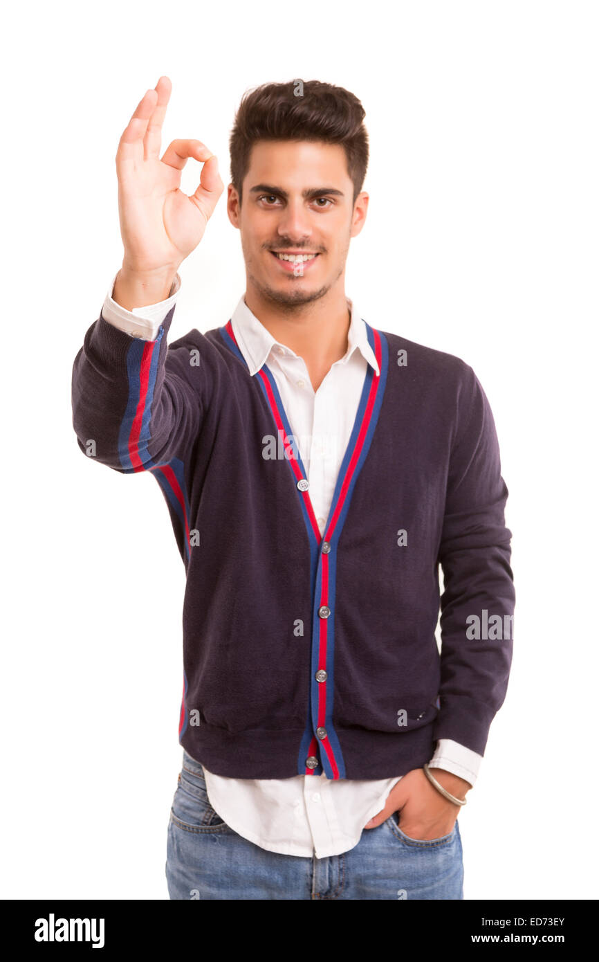 Handsome young man signaling ok, isolated over a white background Stock ...