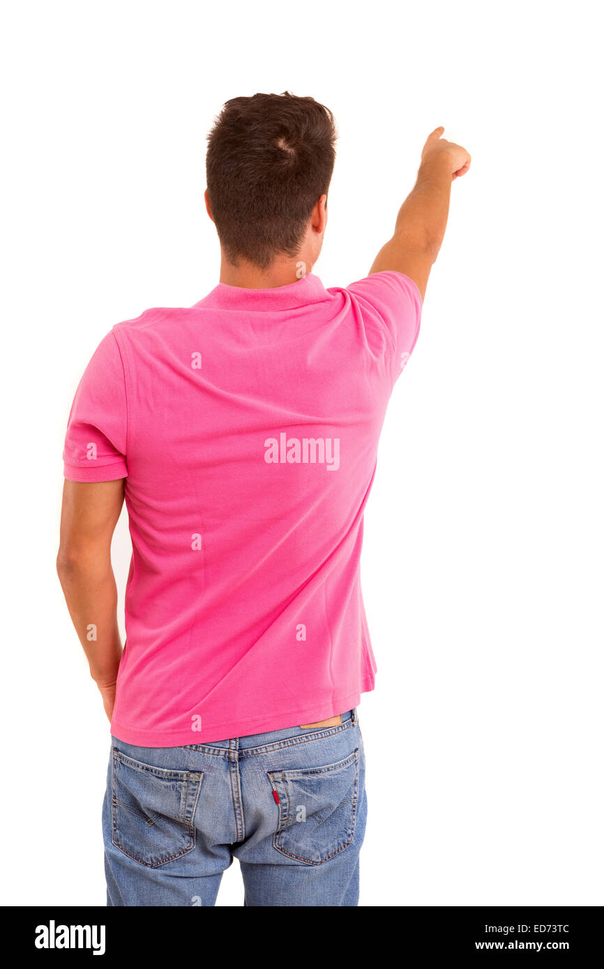 A young man with his back turned to camera, pointing to something Stock ...