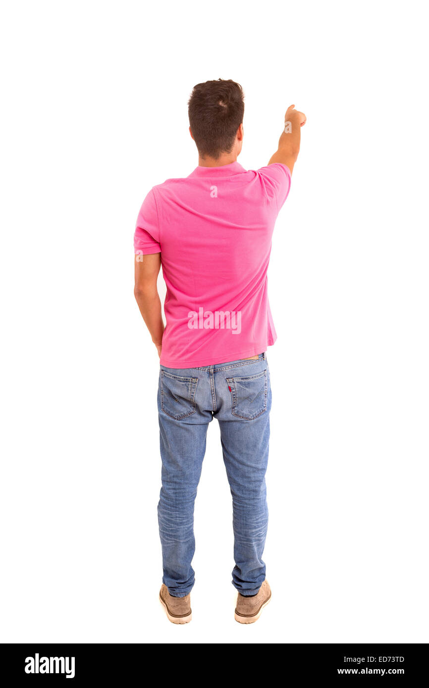 A young man with his back turned to camera, pointing to something Stock ...