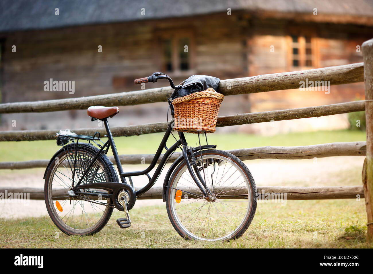 Old bicycle with basket in countryside Stock Photo - Alamy