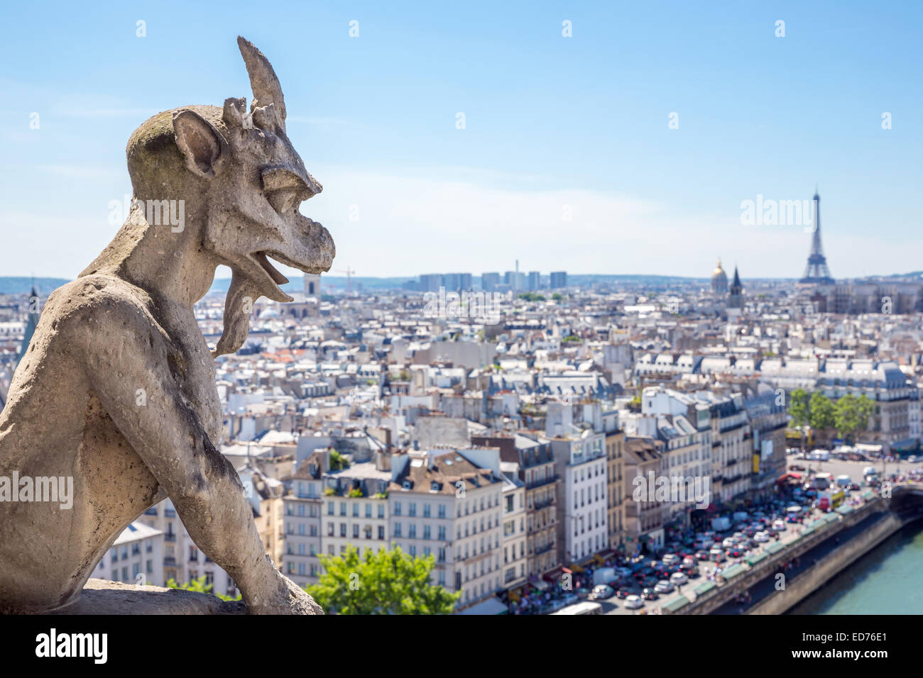 Gargoyle Stryge and demon at Notre Dame of Paris overlooking the ...