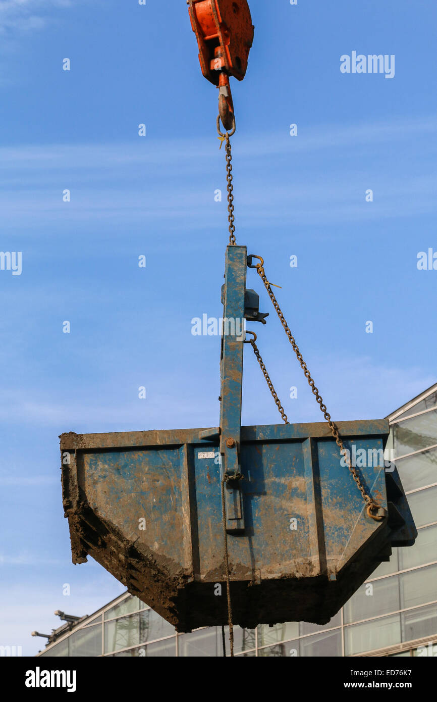 Large builders skip being lifted by a crane during redevelopment work ...