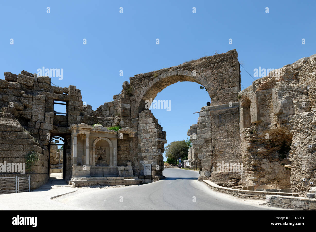 View of the monumental arched Roman gateway and nymphaeum fountain ...
