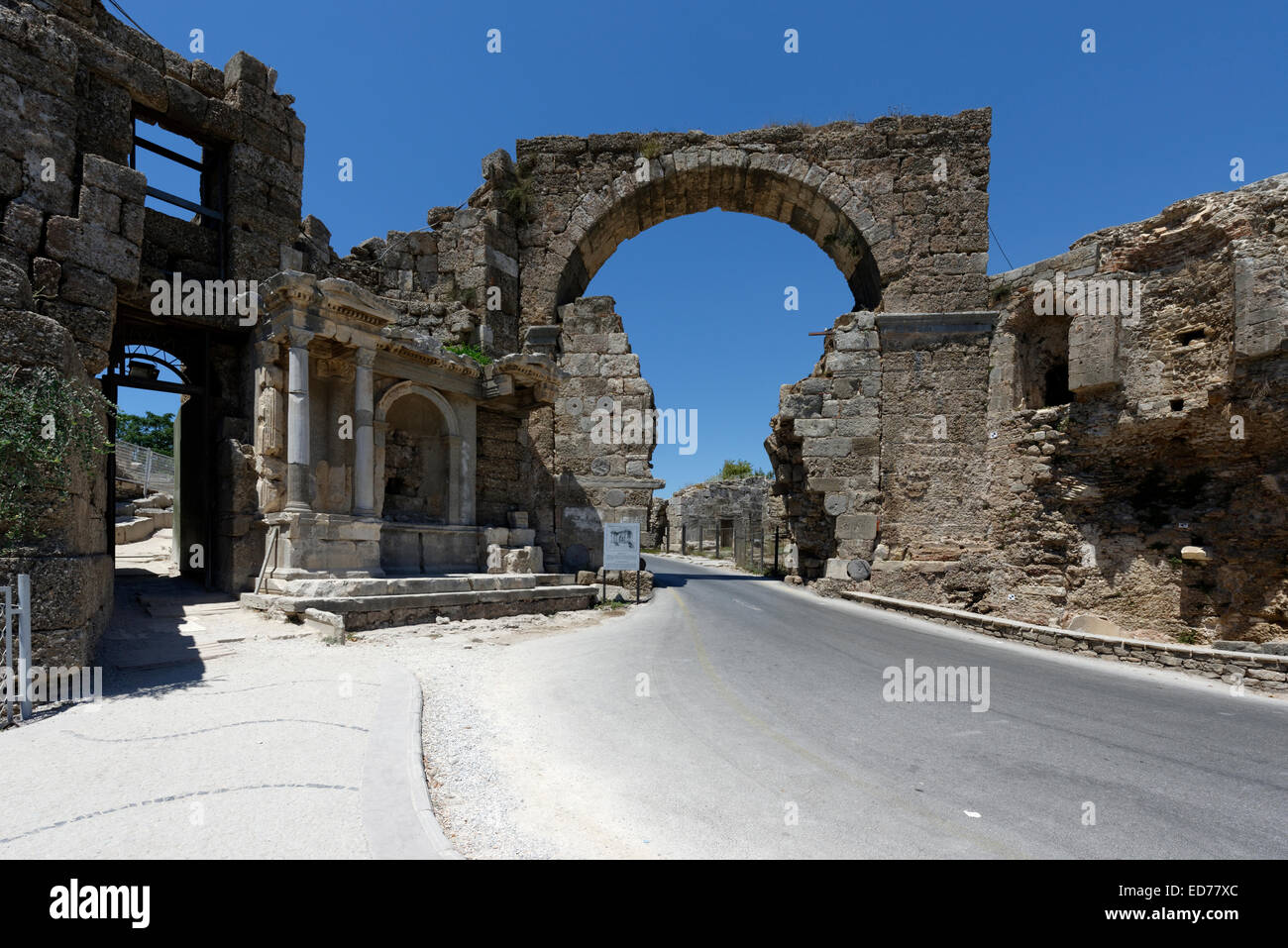 View of the monumental arched Roman gateway and nymphaeum fountain ...