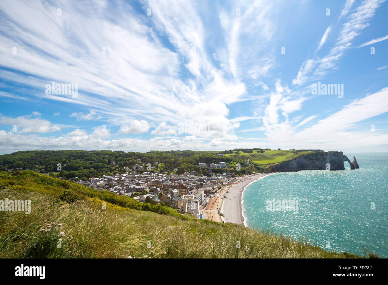 Etretat village, its bay beach and Aval cliff landmark. Aerial view ...