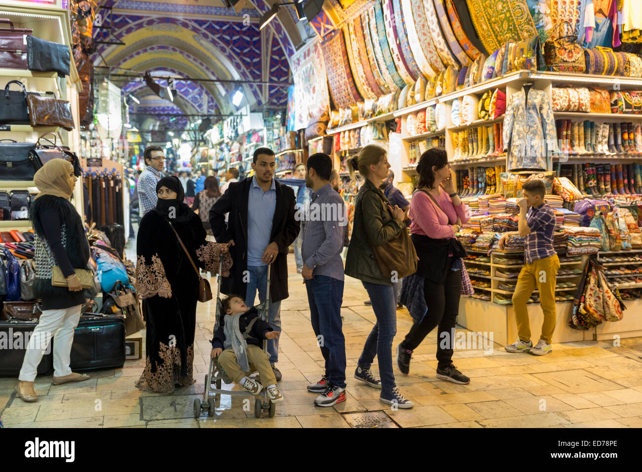 Muslim family shopping and tourists in The Grand Bazaar, Kapalicarsi ...