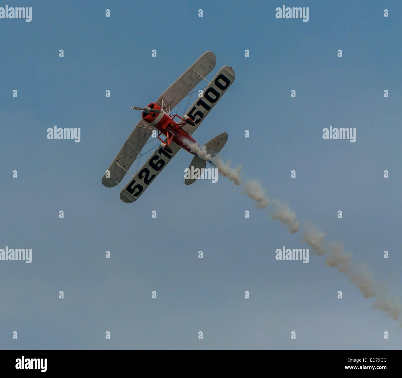 bi plane in sky with emission skywriter Stock Photo - Alamy